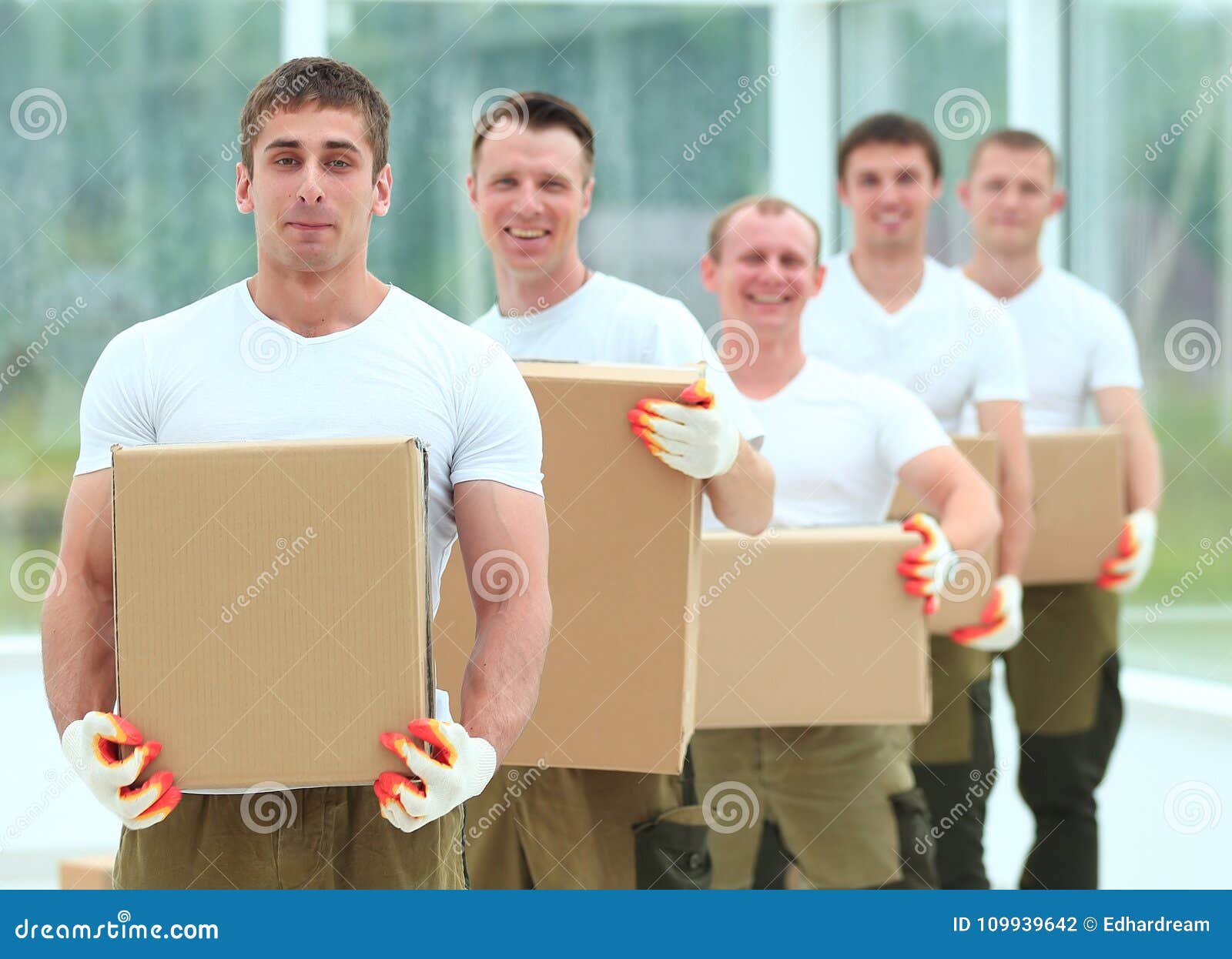 Team of Builders with Boxes of Building Materials Stock Photo - Image ...