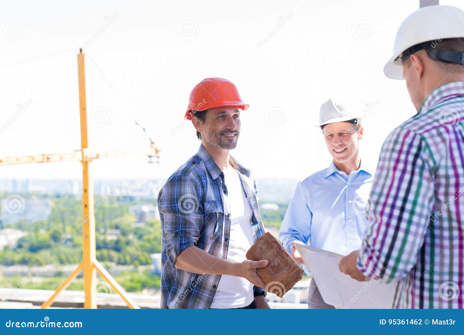Team of Builders on Construction Site, Contractor Giving Apprentice ...