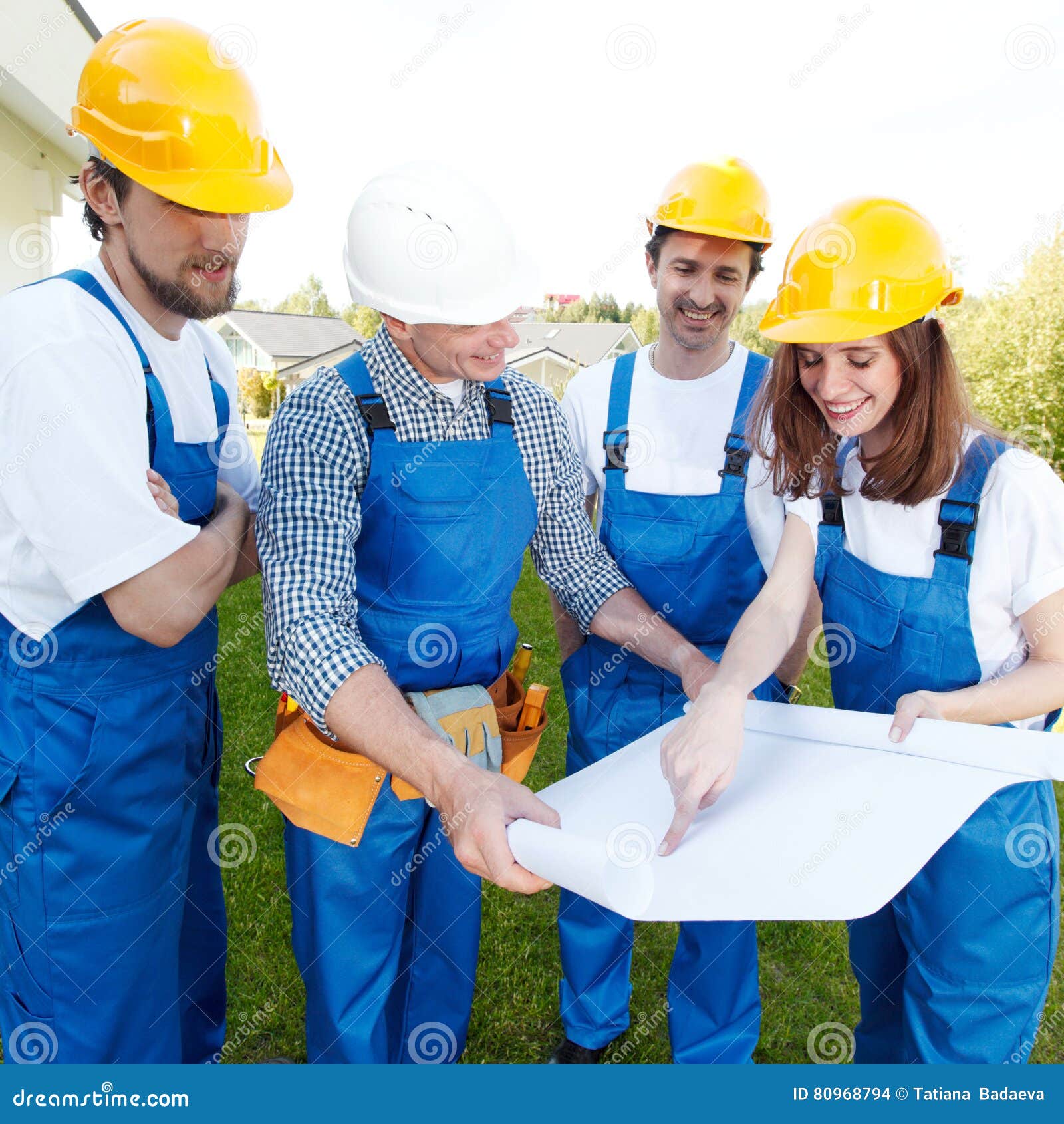 Team of buildres with plan stock photo. Image of group - 80968794
