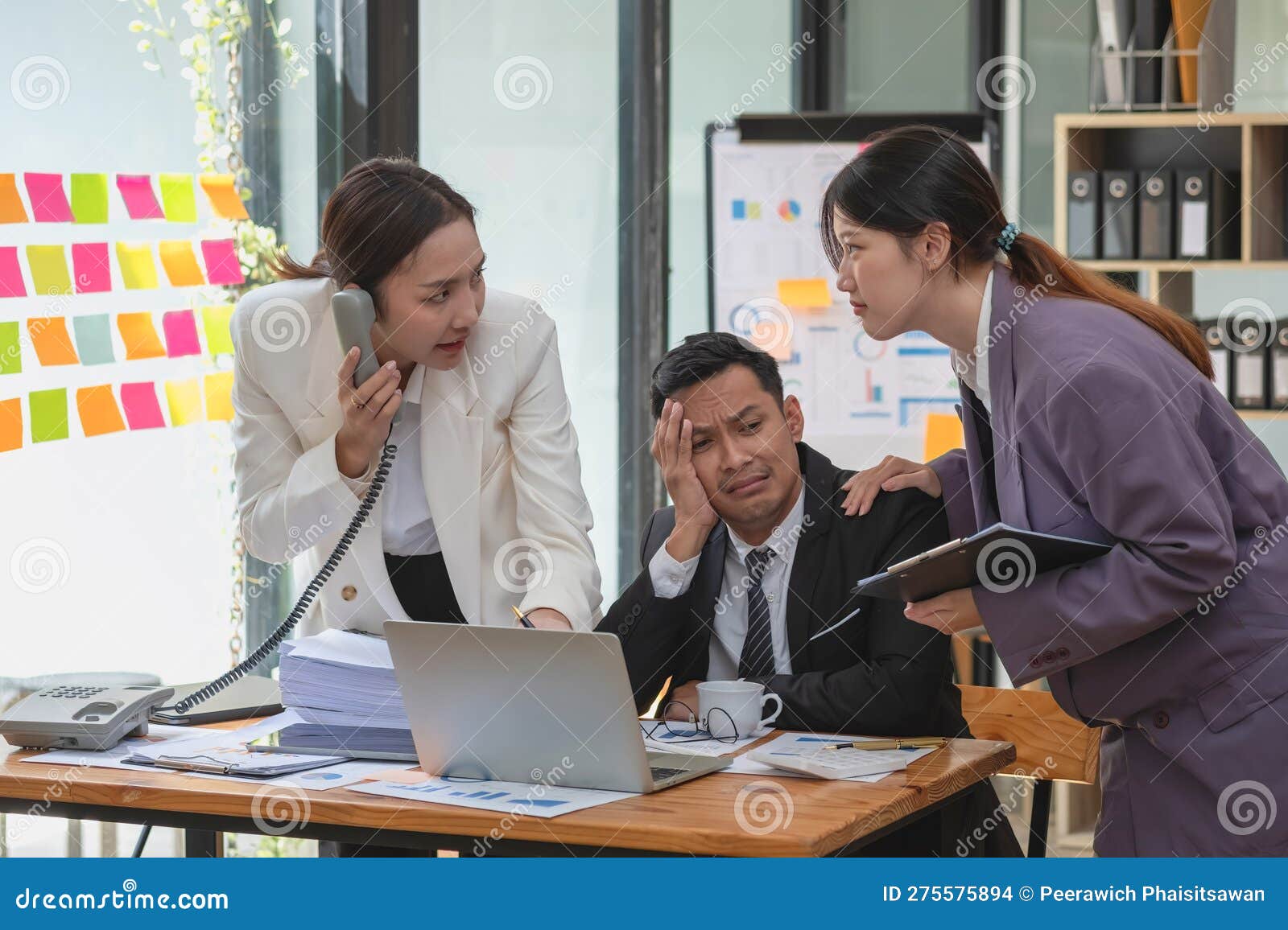 A Team of Business People are Busy Working on the Phone. Laptop ...
