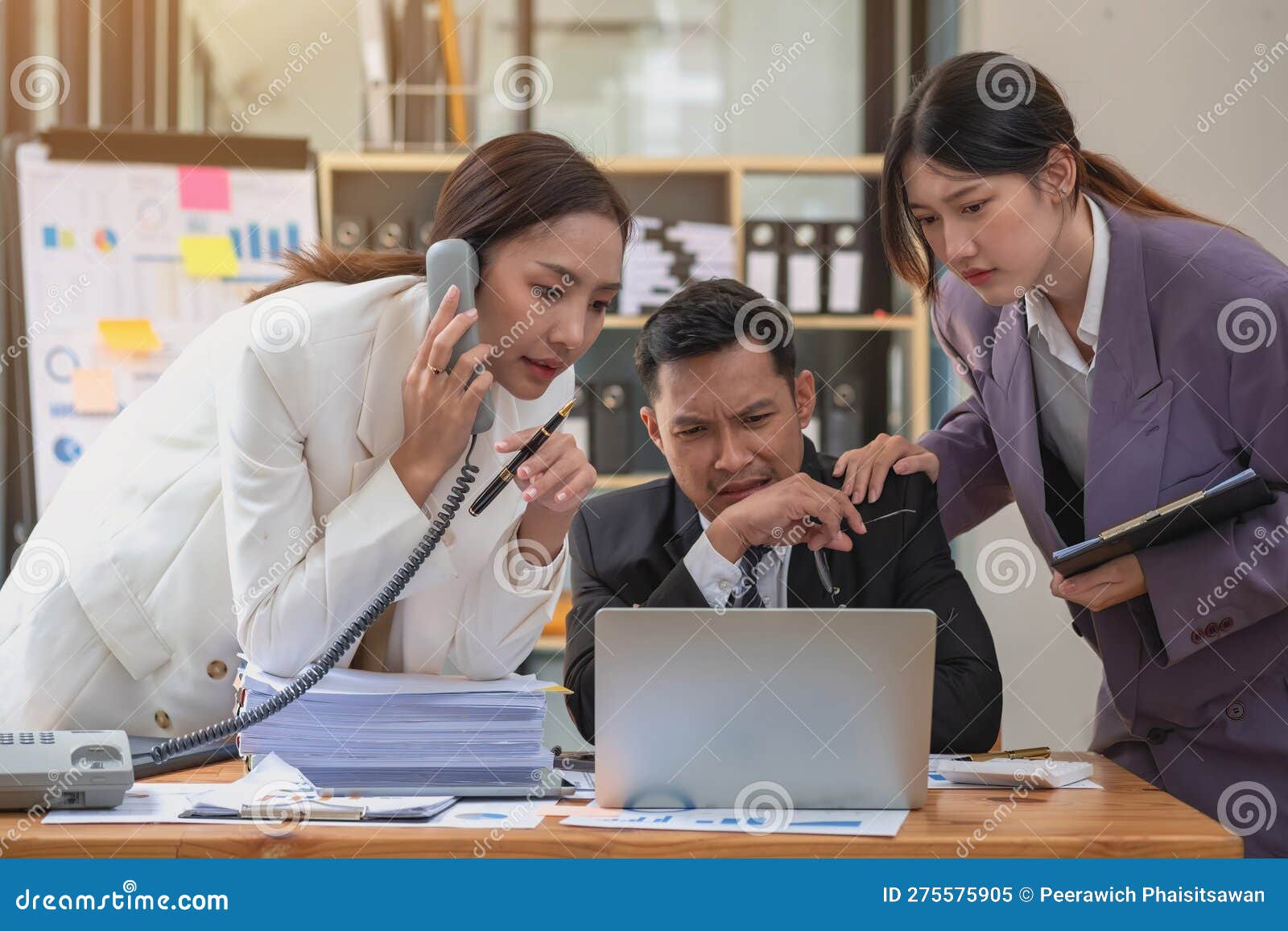 A Team of Business People are Busy Working on the Phone. Laptop ...