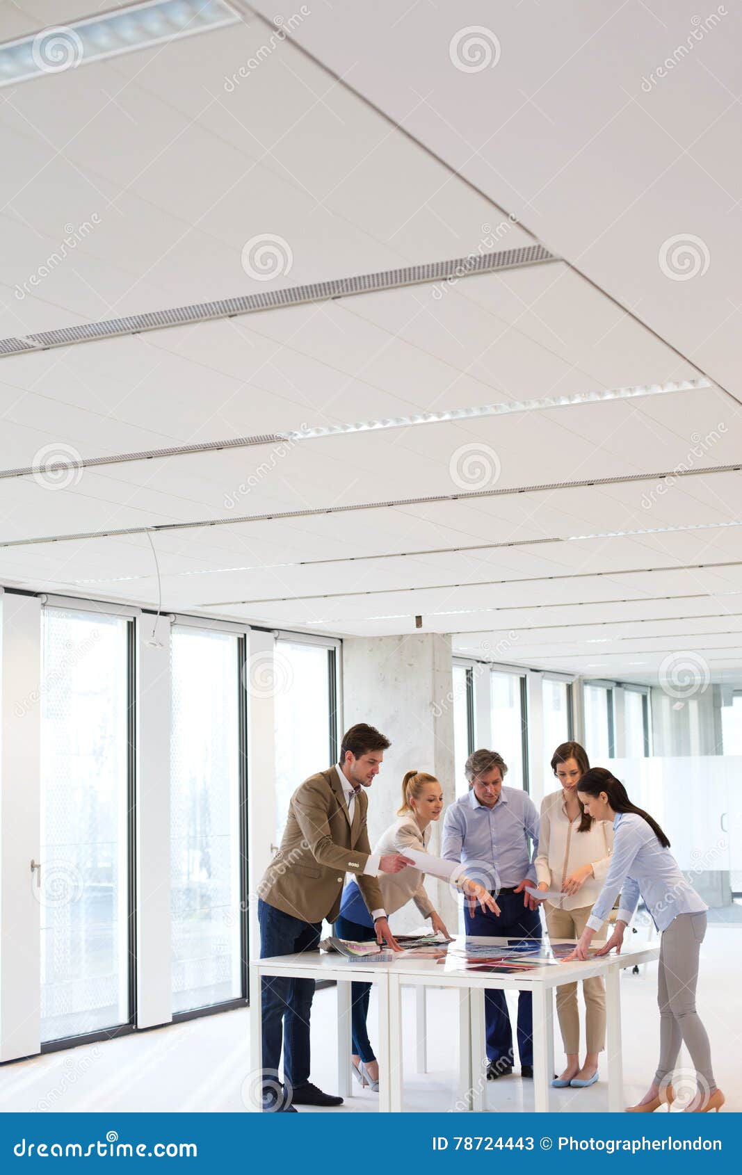 Team of Business People Having Discussion at Table in Office Stock ...