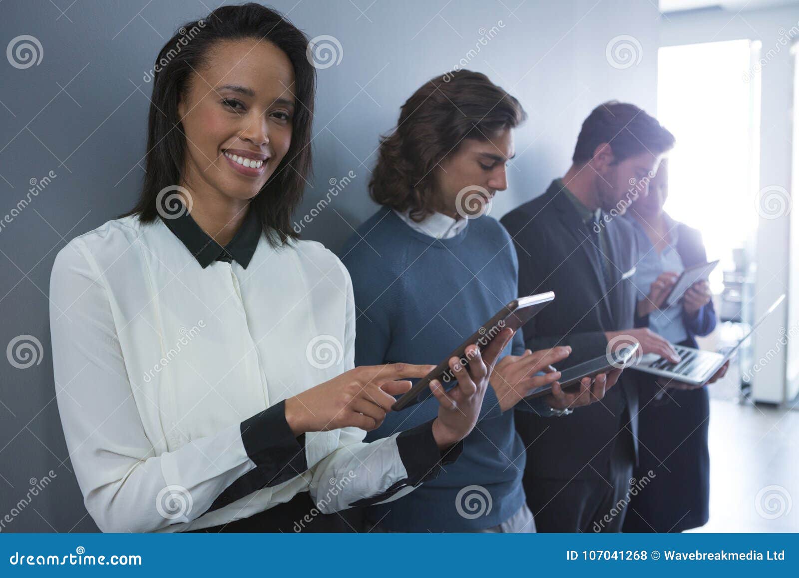 Team of Business People Using Electronic Devices Stock Photo - Image of ...