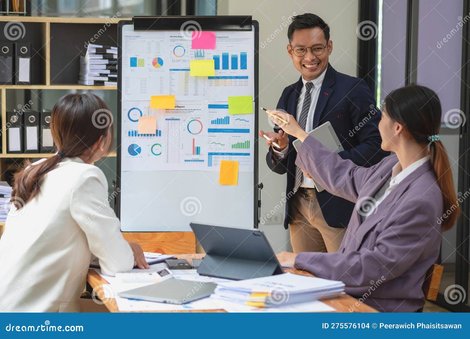 Team Business Three Smiling and Happy Asian Men and Women Team Using ...