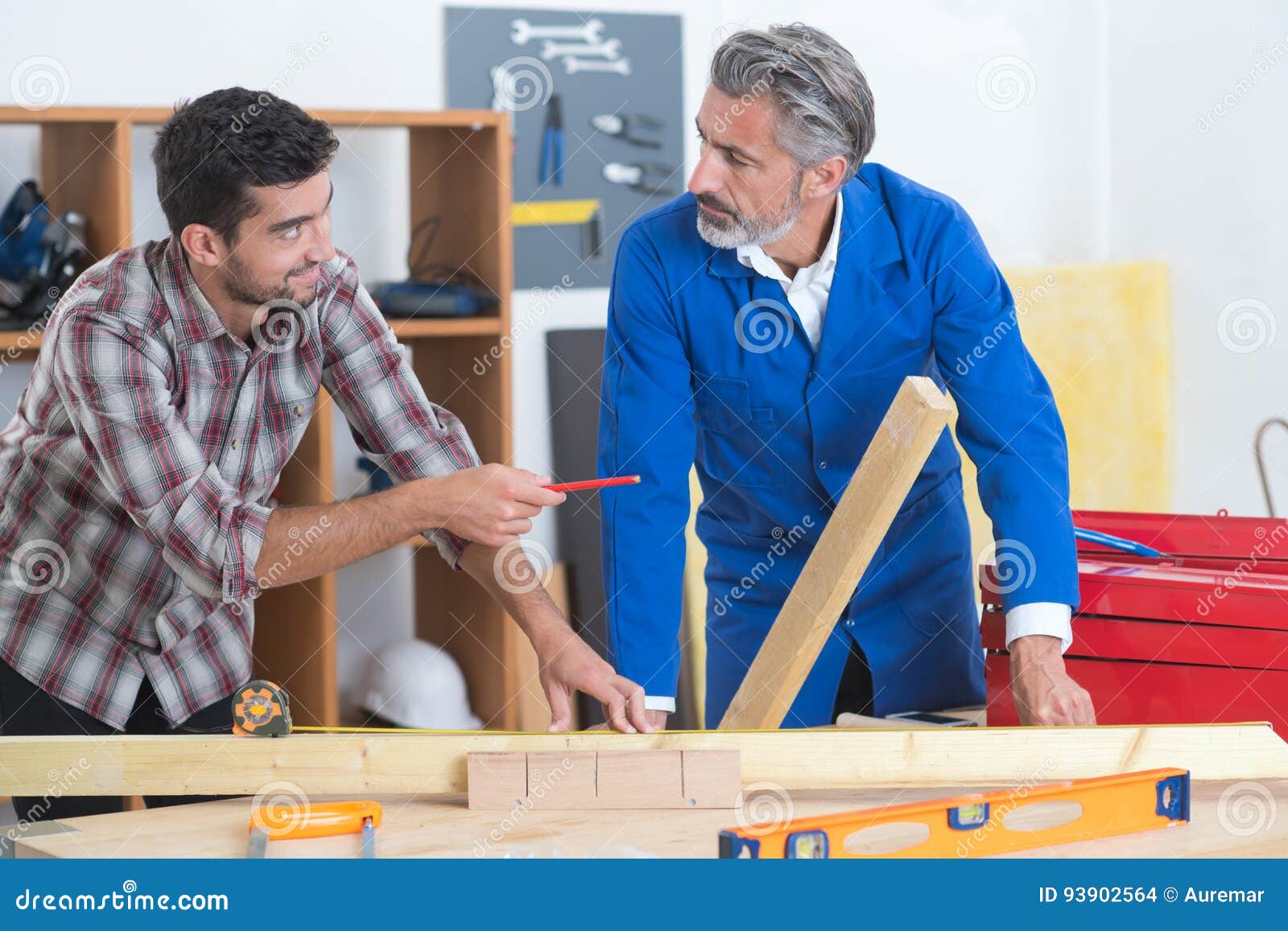 Team Carpenters Comparing Work Pieces Stock Photo - Image of carpenter ...