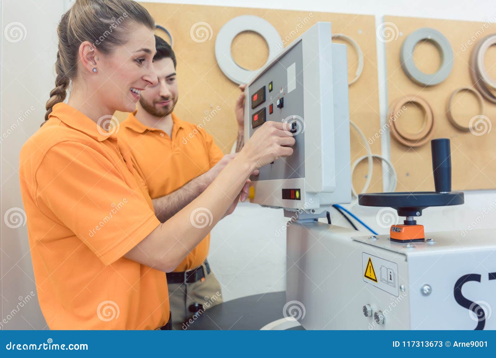Team of Carpenters Programming CNC Machine in Their Workshop Stock ...