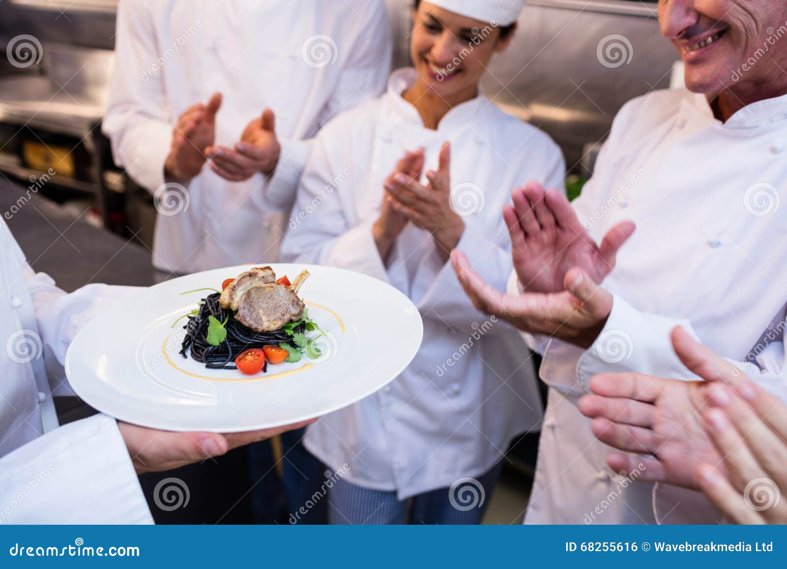 Team of chefs applauding stock photo. Image of cooked - 68255616