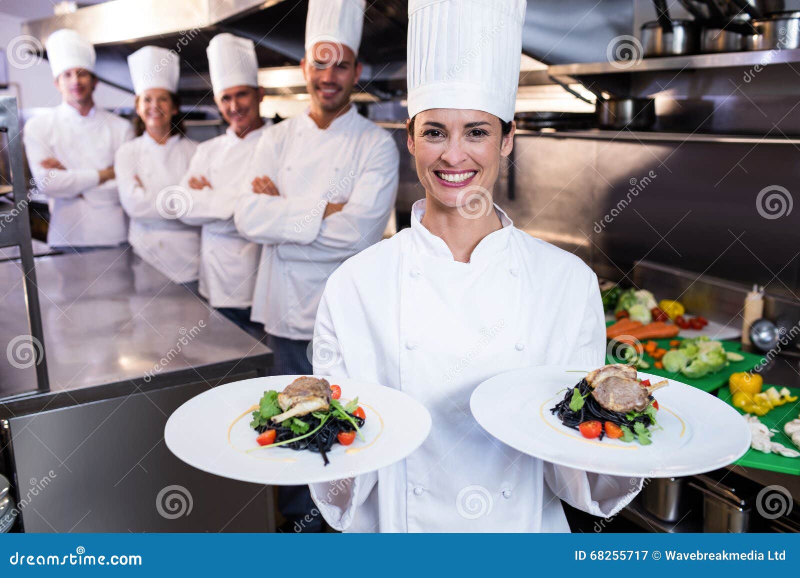 Team of Chefs with One Presenting Dishes Stock Image - Image of five ...