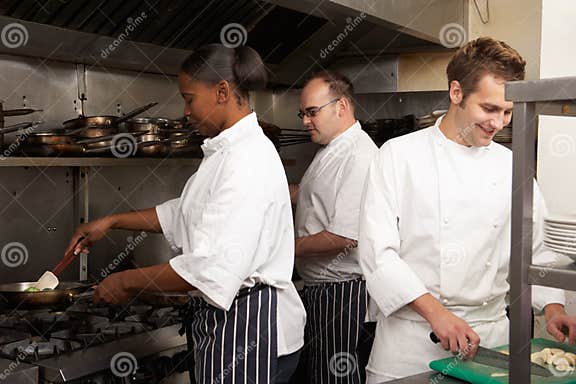 Team of Chefs Preparing Food Stock Image - Image of trainee, whites ...
