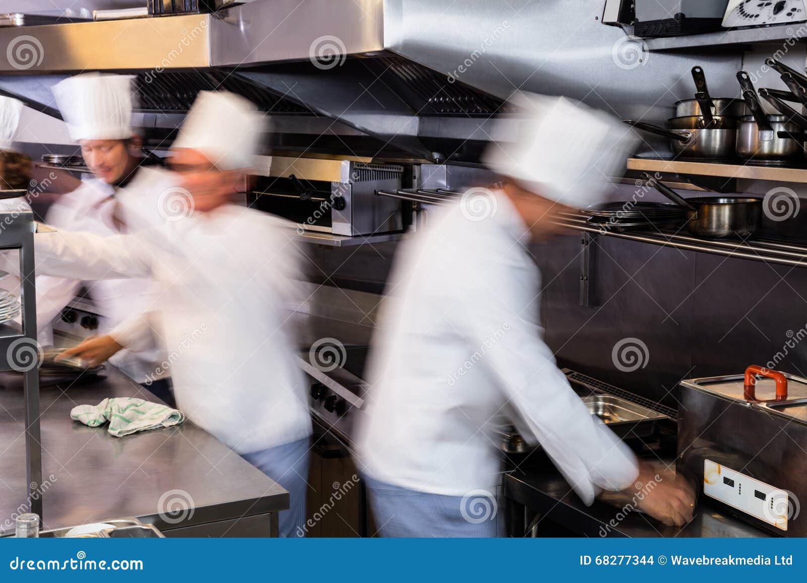 Team of Chefs Preparing Food in the Kitchen Stock Photo - Image of ...