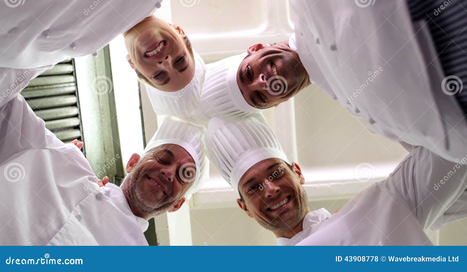 Team of Chefs Standing in Circle Looking Down at Camera Stock Footage ...