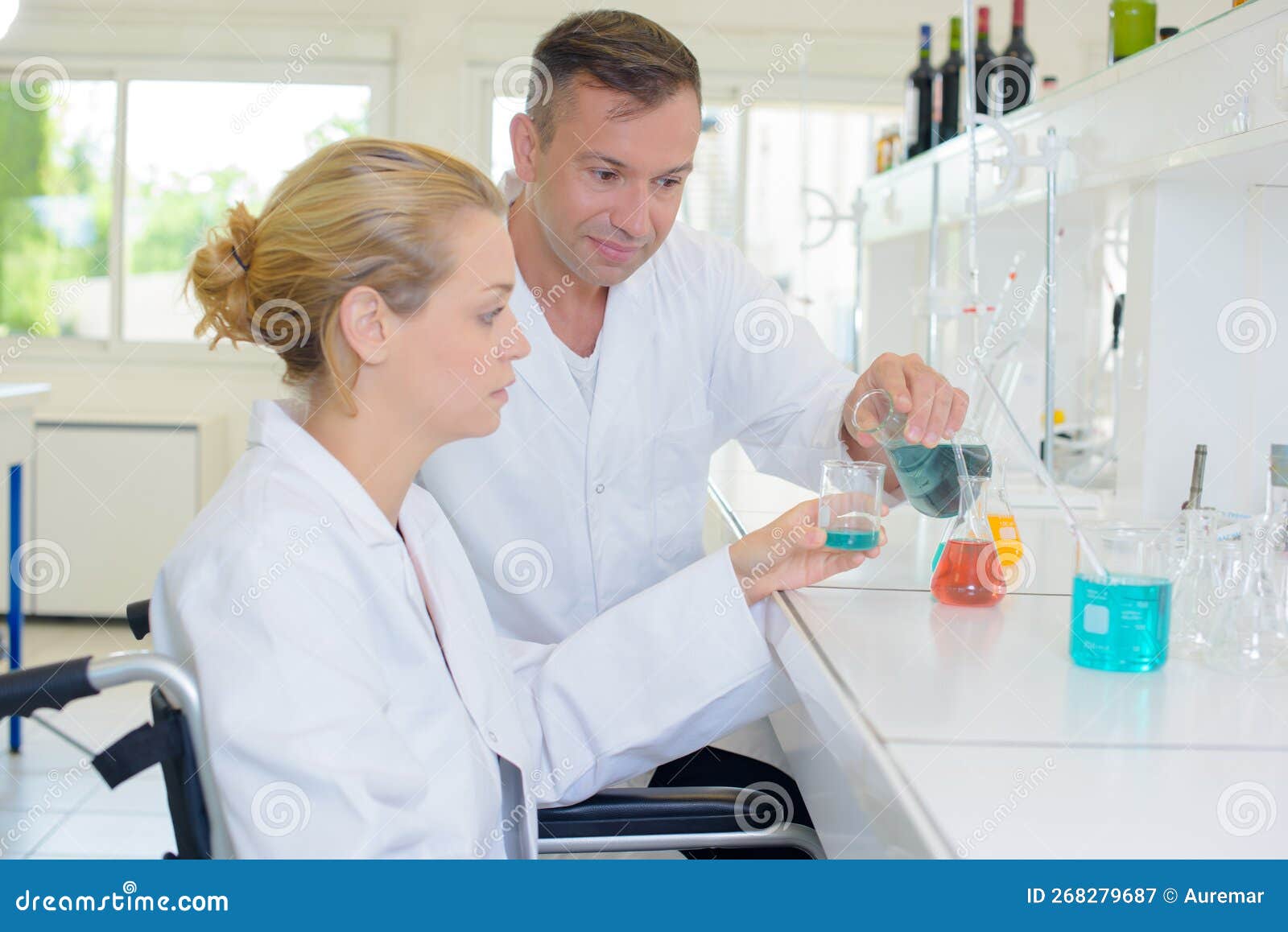 Team Chemists Mixing Liquids Stock Image - Image of young, middleaged ...
