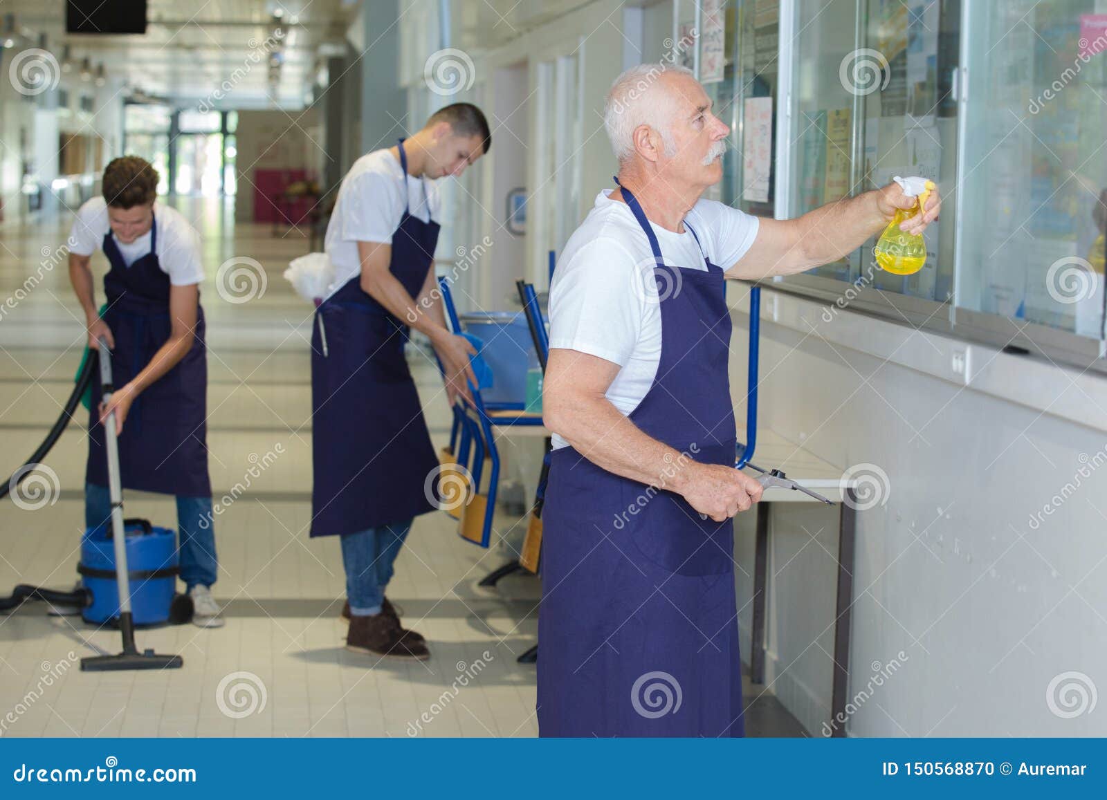 Team cleaning a corridor stock photo. Image of plant - 150568870