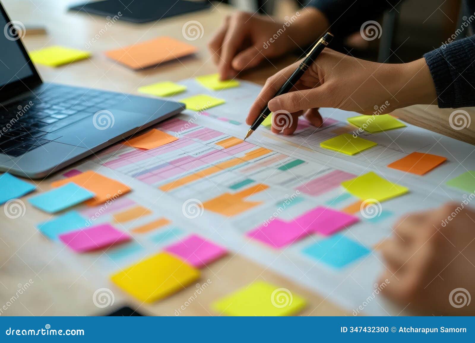 Team Collaboration in Progress with Colorful Sticky Notes on Project ...