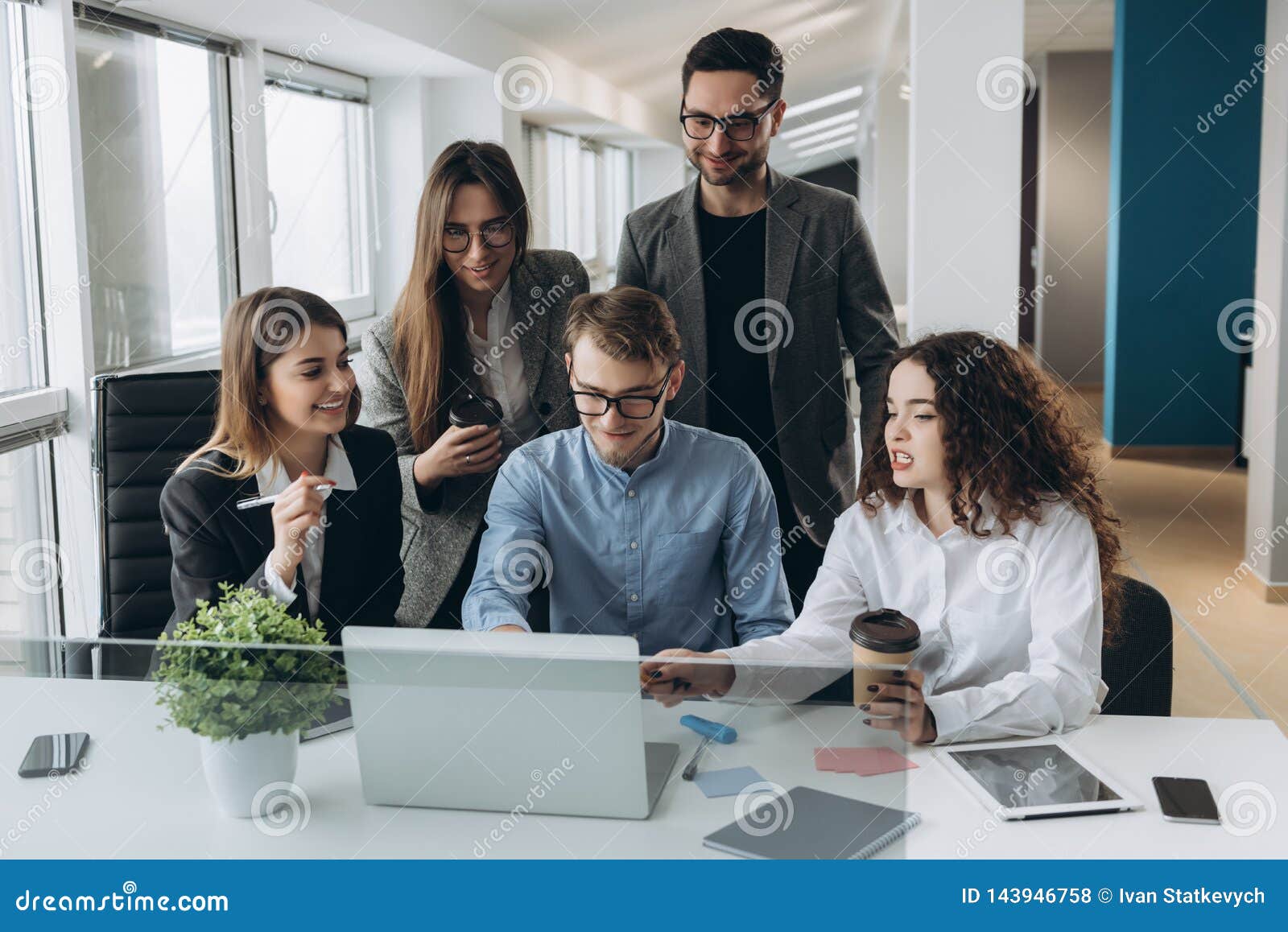 Team of Colleagues Brainstorming Together while Working on the Computer ...