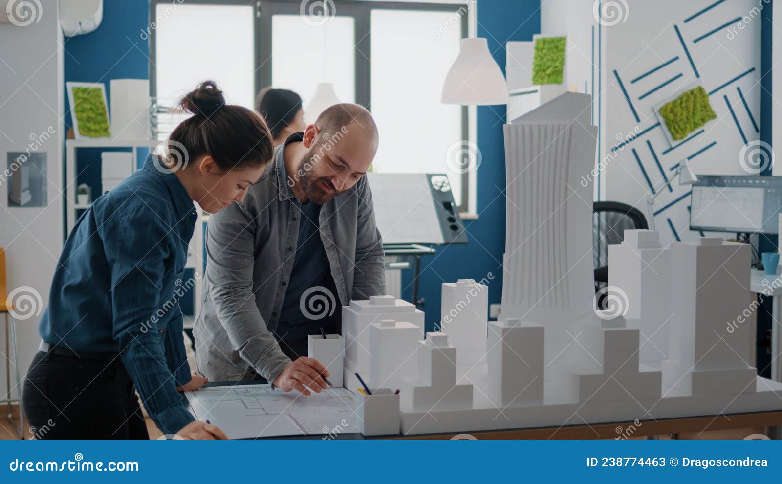 Team of Colleagues Using Building Model for Inspiration To Design ...