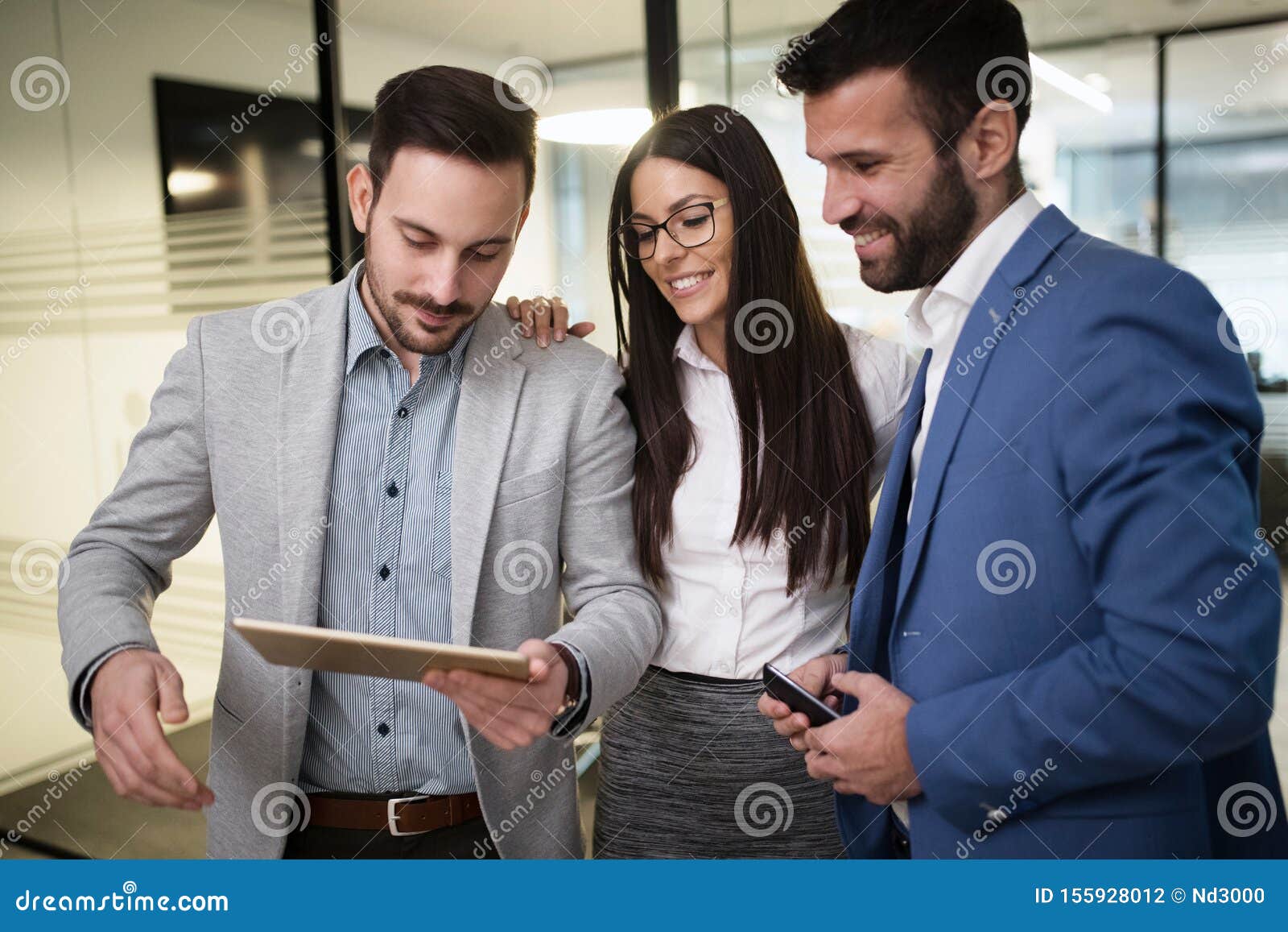 Team of Colleagues Working Together on Tablet Stock Photo - Image of ...
