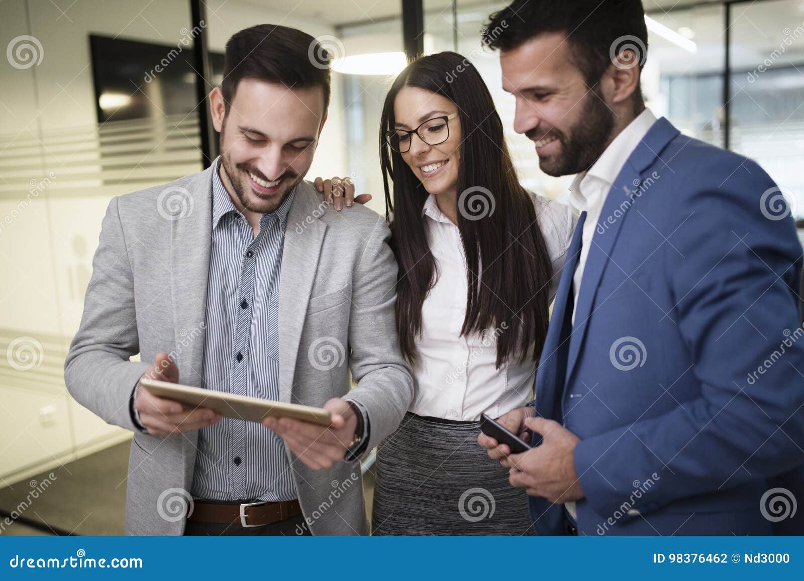 Team of Colleagues Working Together on Tablet Stock Photo - Image of ...