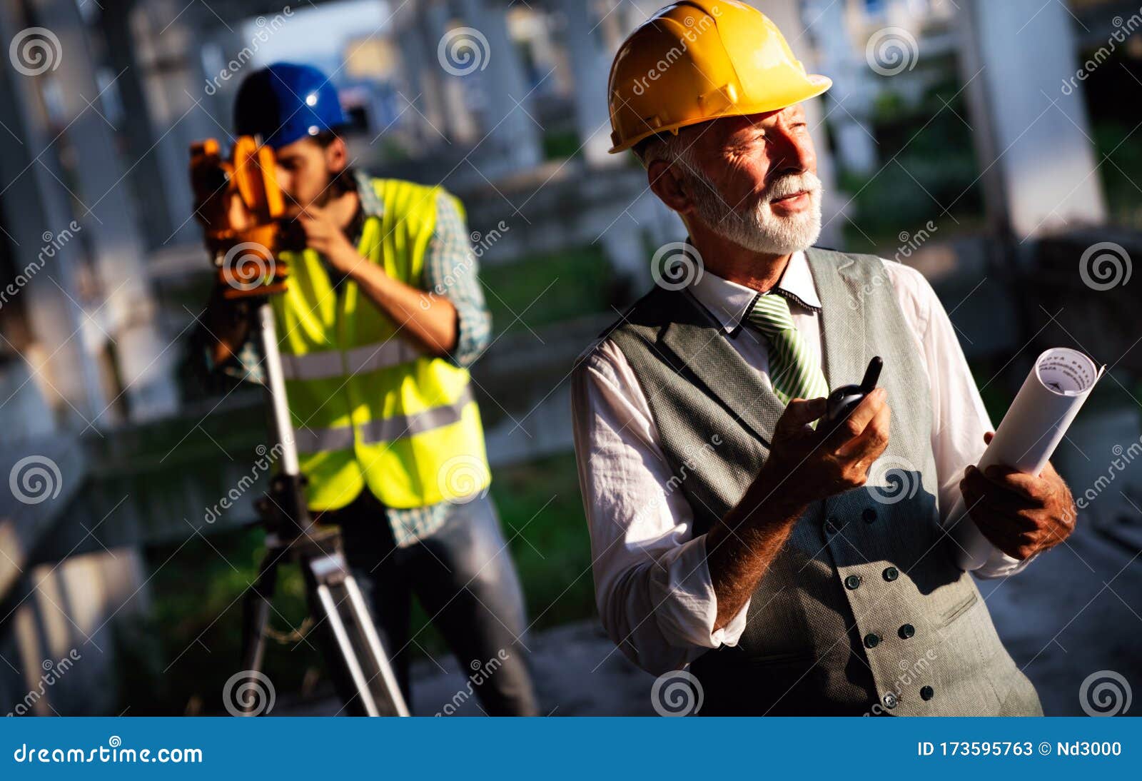 Team of Construction Engineers, Architects Working on Building Site ...