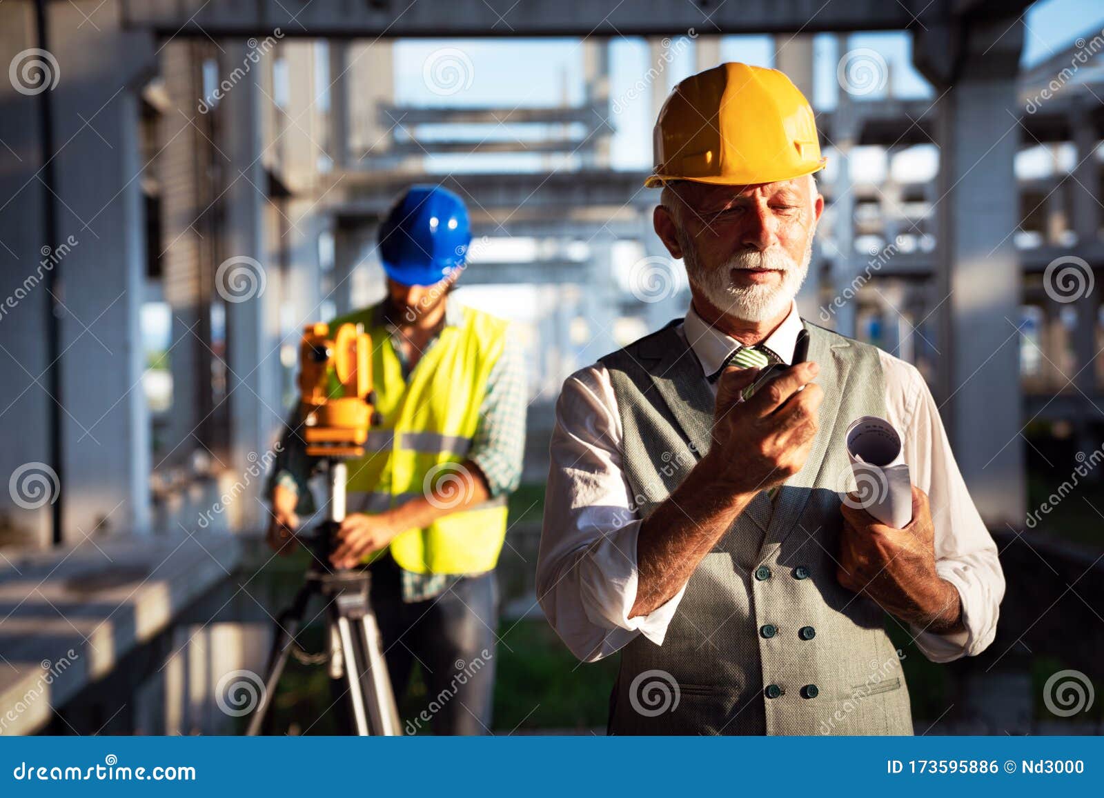 Team of Construction Engineers, Architects Working on Building Site ...