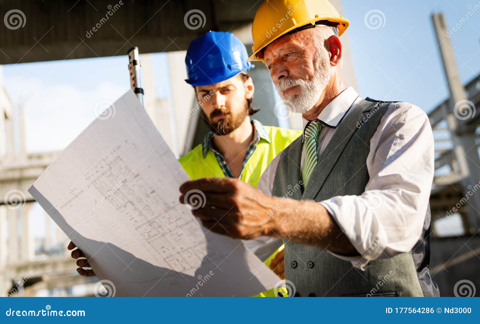Team of Construction Engineers, Architects Working on Building Site ... Team of Construction Engineers, Architects Working on Building Site ...