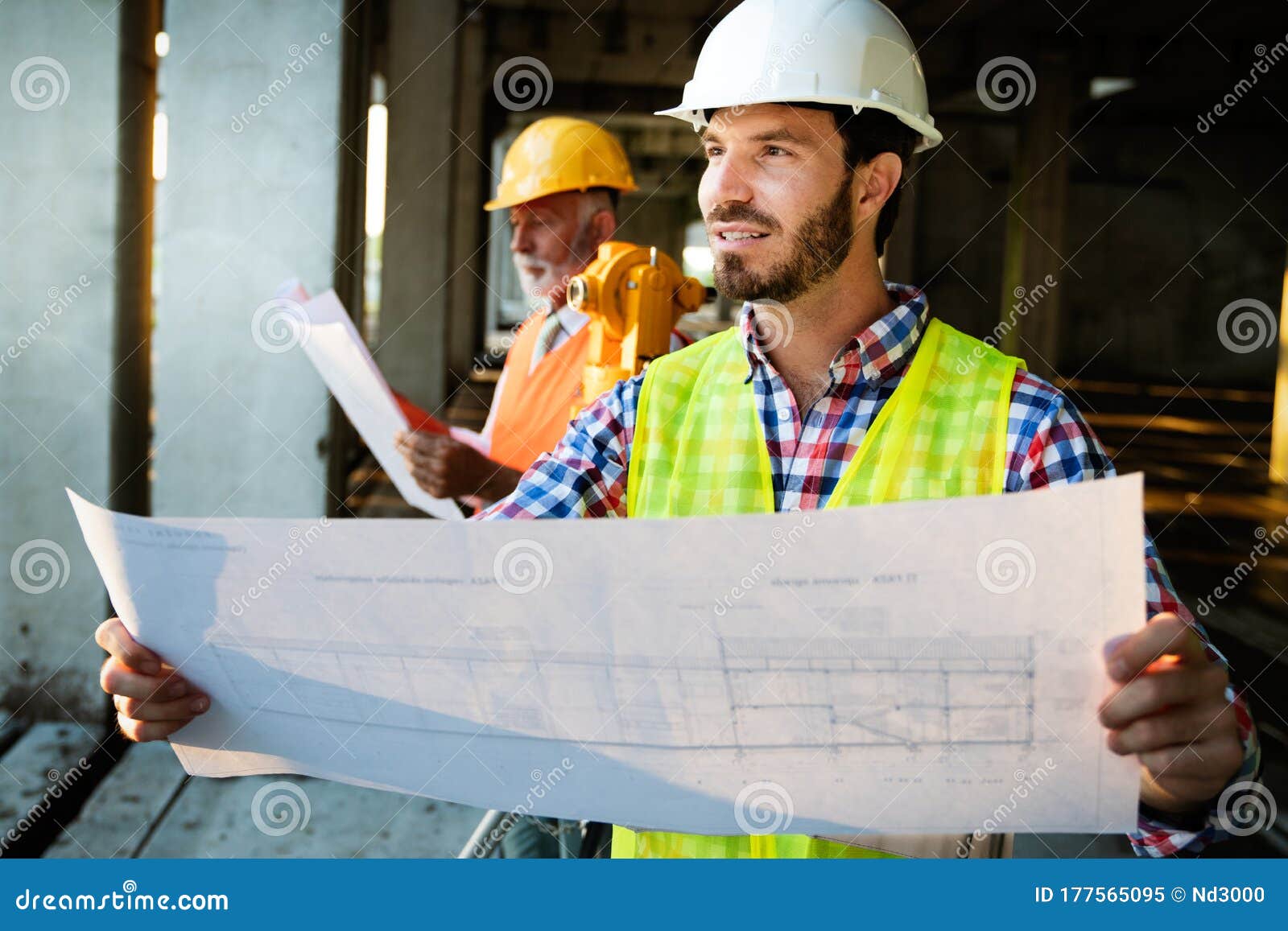 Team of Construction Engineers, Architects Working on Building Site ... Team of Construction Engineers, Architects Working on Building Site ...