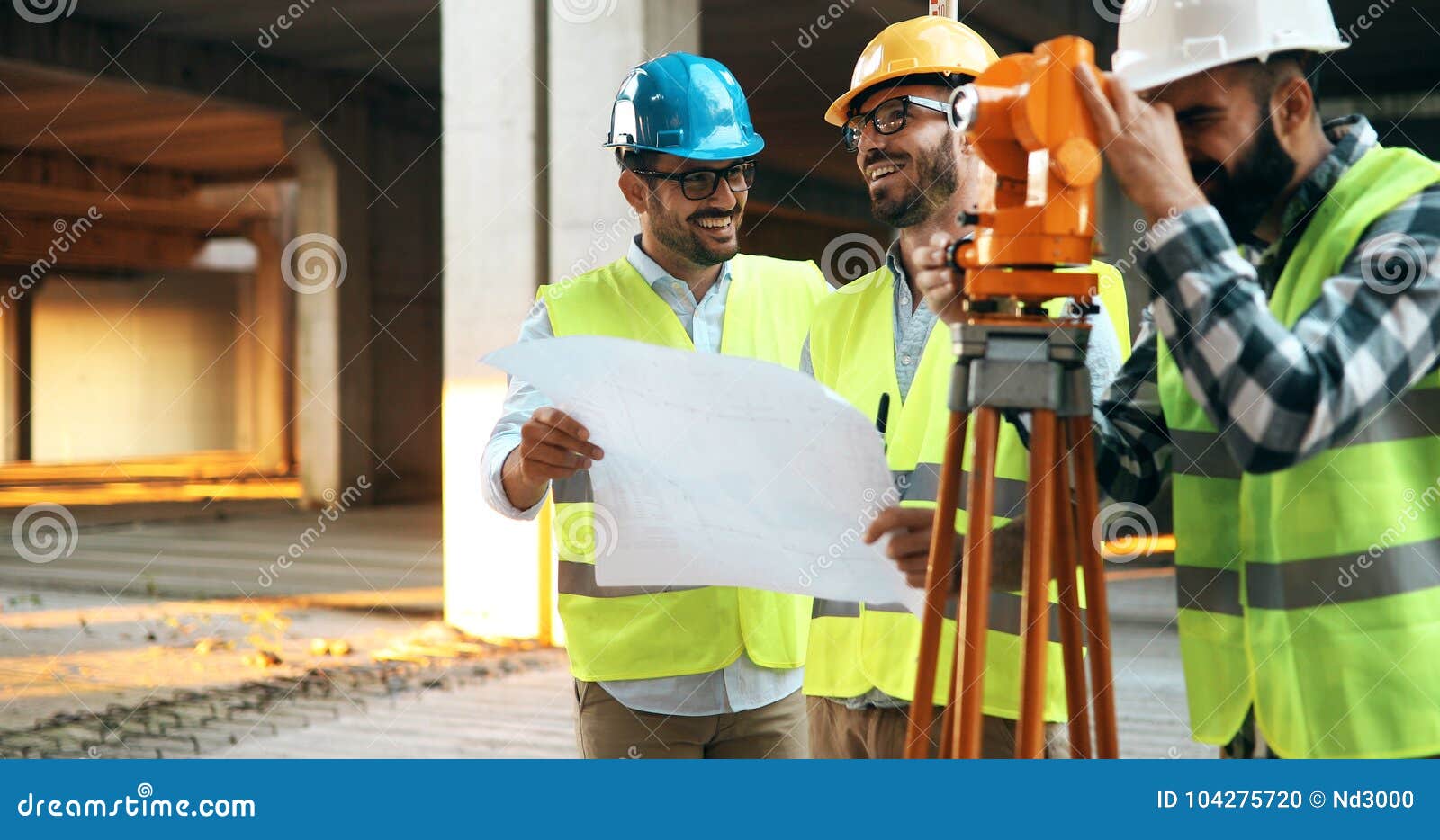 Team of Construction Engineers Working on Building Site Stock Photo ...