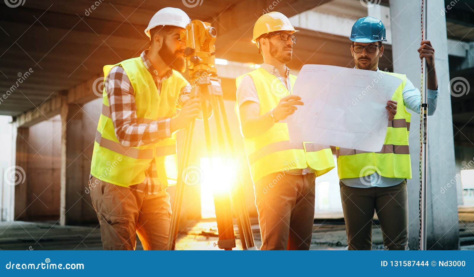 Team of Construction Engineers Working on Building Site Stock Photo ...