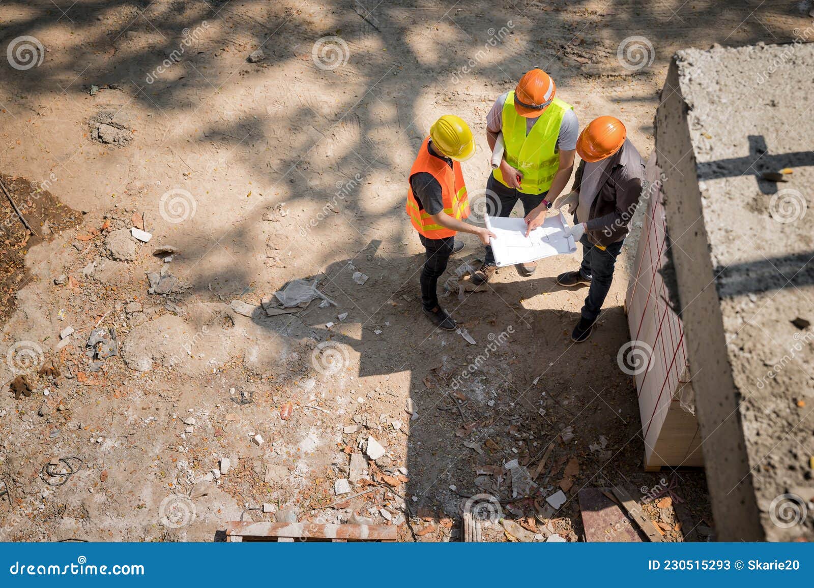 Team of Construction Workers Discussing Project Details with Executive ...