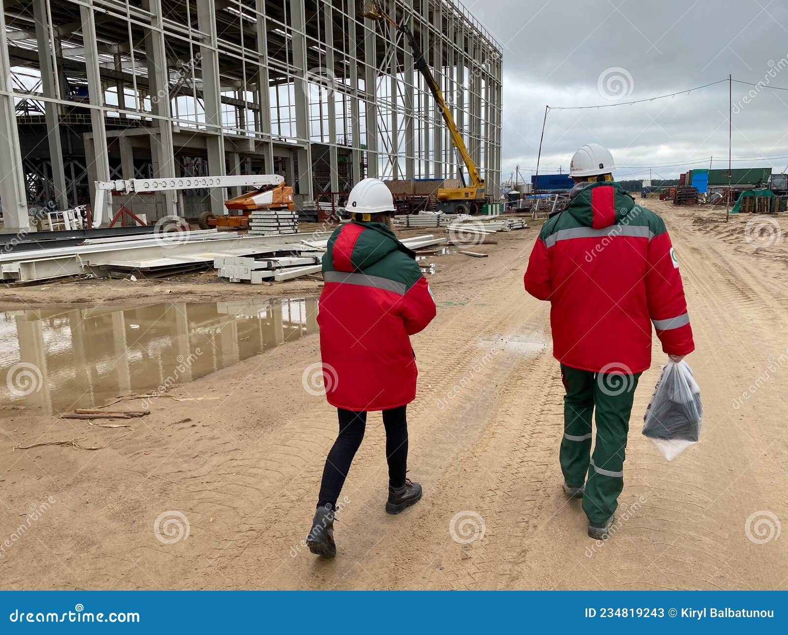 A Team of Construction Workers with Helmets at Work Place in a Factory ...