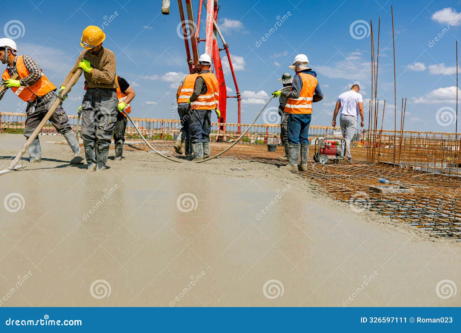 Workers in Rubber Boots are Pouring Fresh Concrete in Building ...
