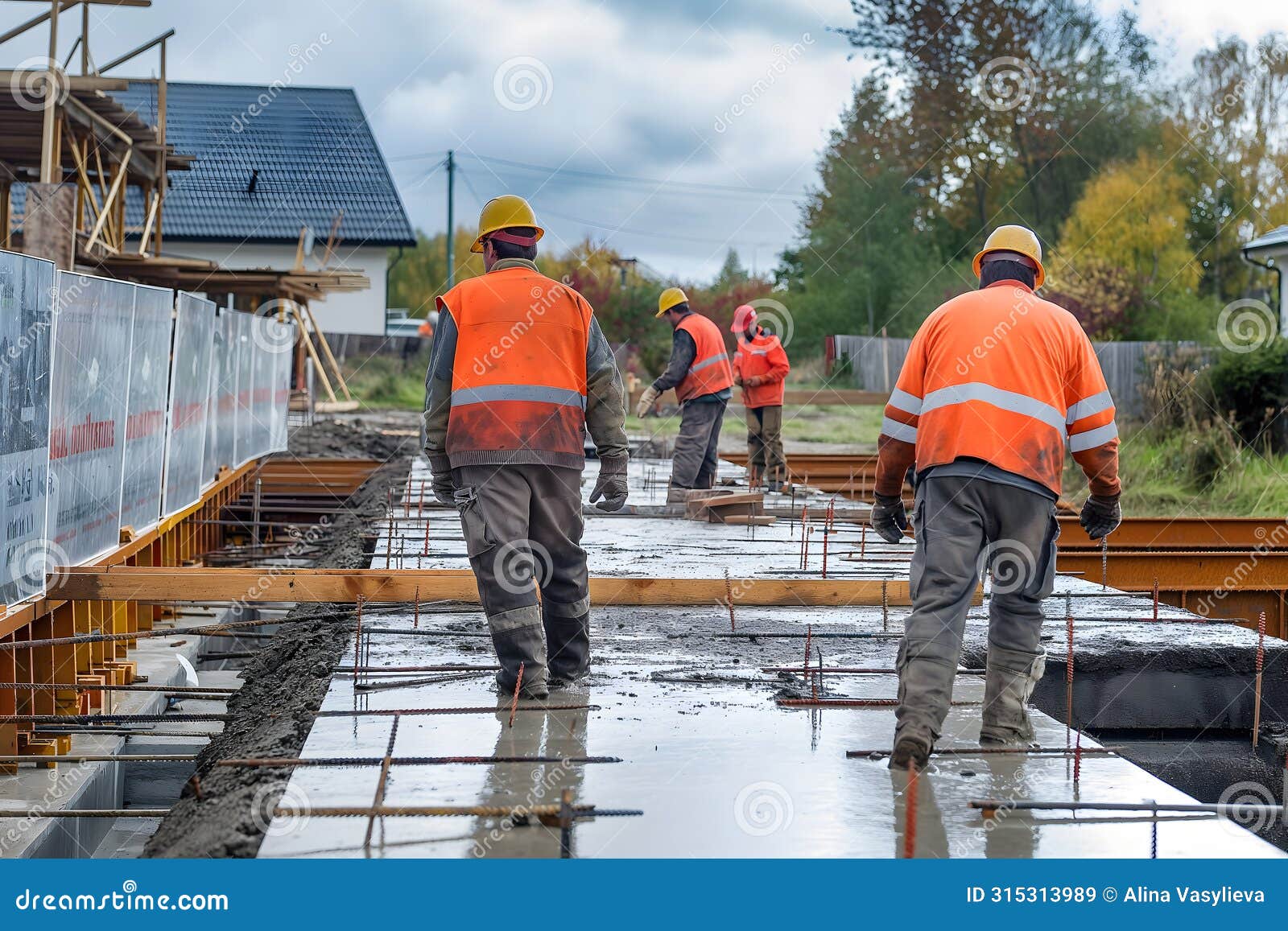 Team of the Construction Workers Works on Foundation of Contemporary ...