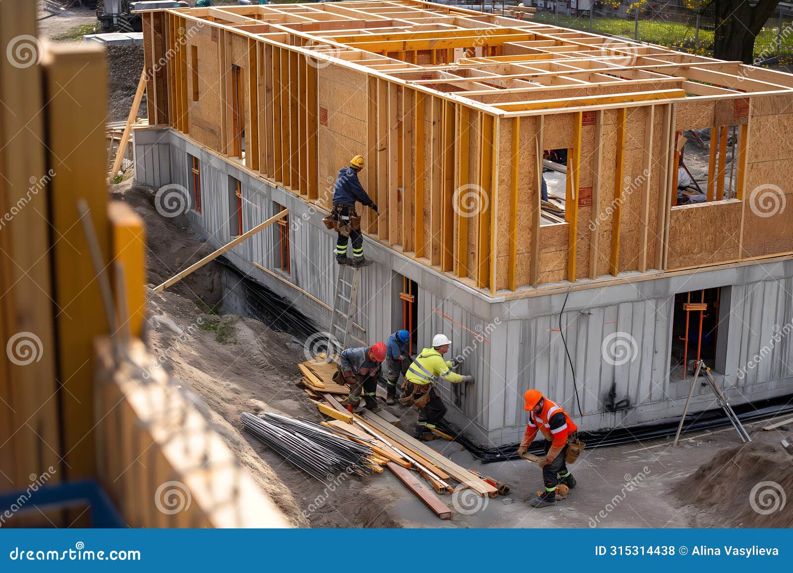 Team of the Construction Workers Works on Foundation of Contemporary ...