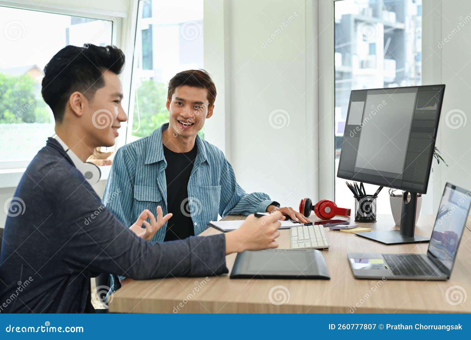 Team of Content Creator Working Together, Editing Video Footage with ...