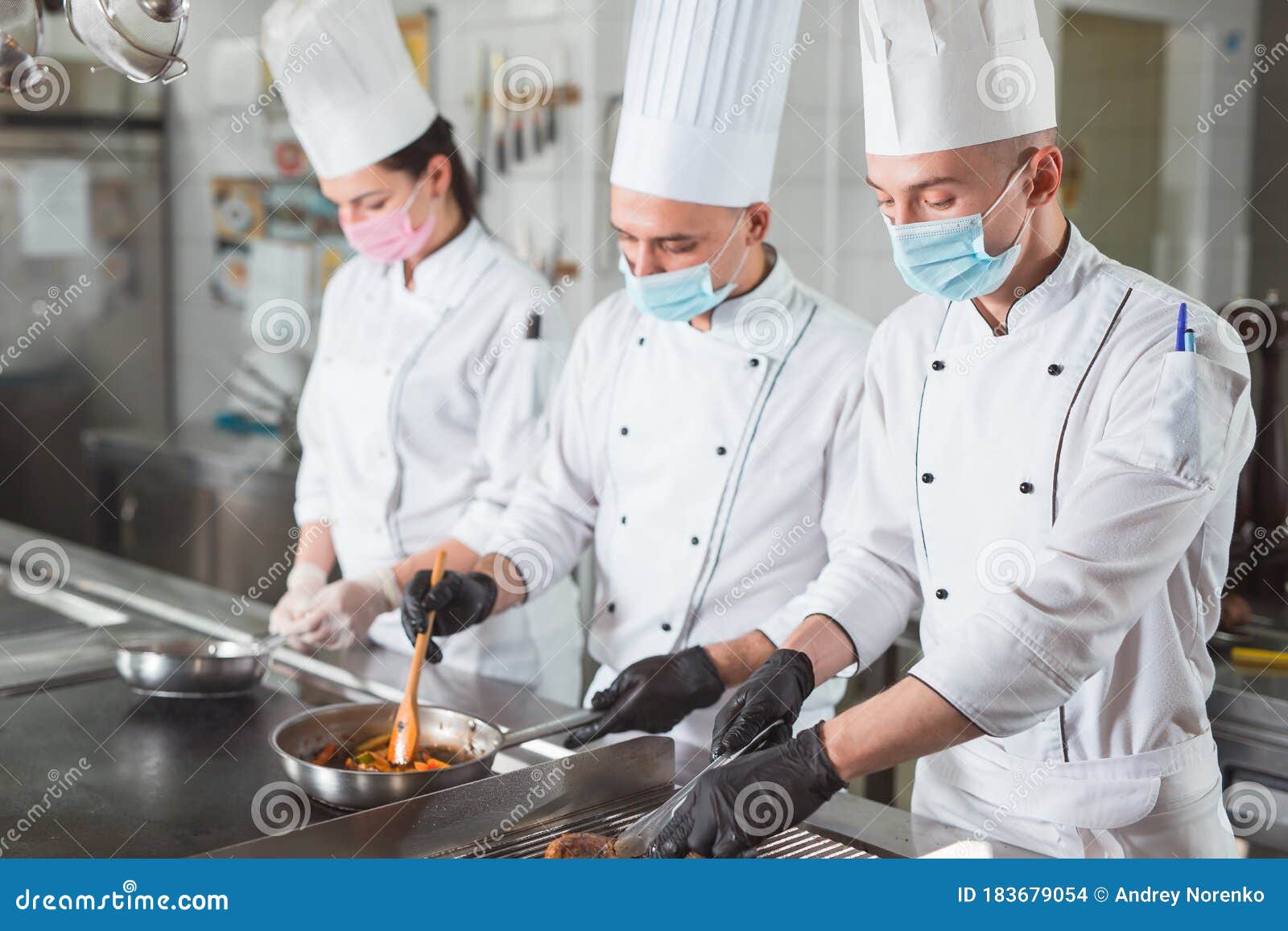 Team of Cooks Cooks in a Restaurant Stock Photo - Image of kitchen ...