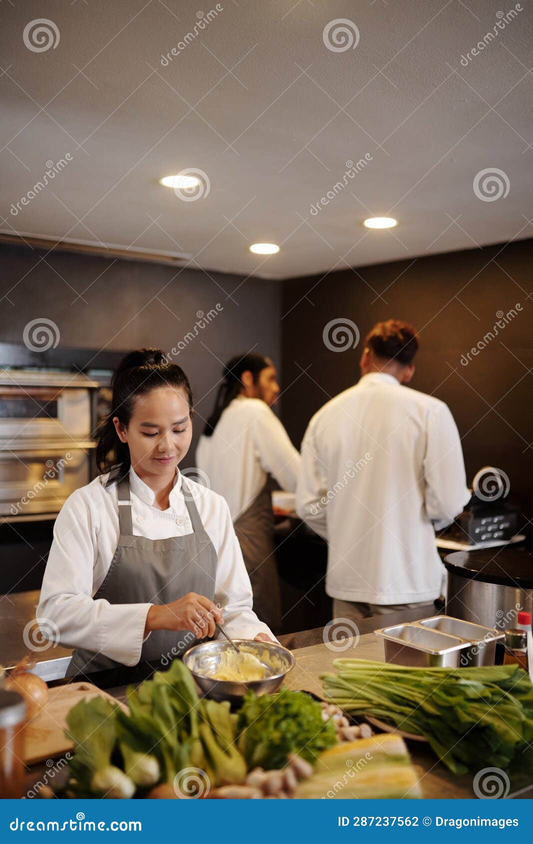 Team of Cooks Working in Kitchen Stock Photo - Image of food ...