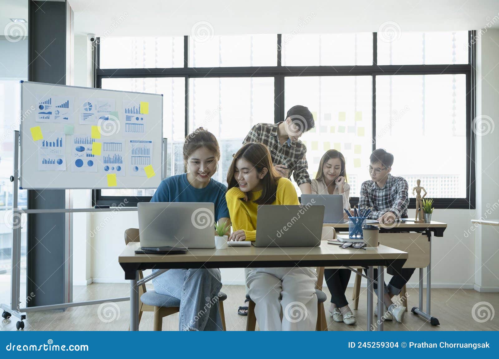 Team of Creative Designer Collaborating on Their New Project at Office ...