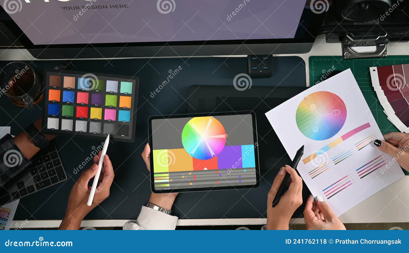 Team Creative Designers Working with Modern Devices and Color Swatch ...