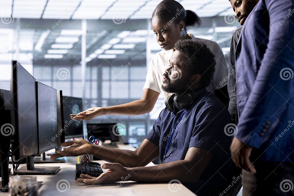 Group of Server Hub Employees Working Together on Debugging Code Stock ...