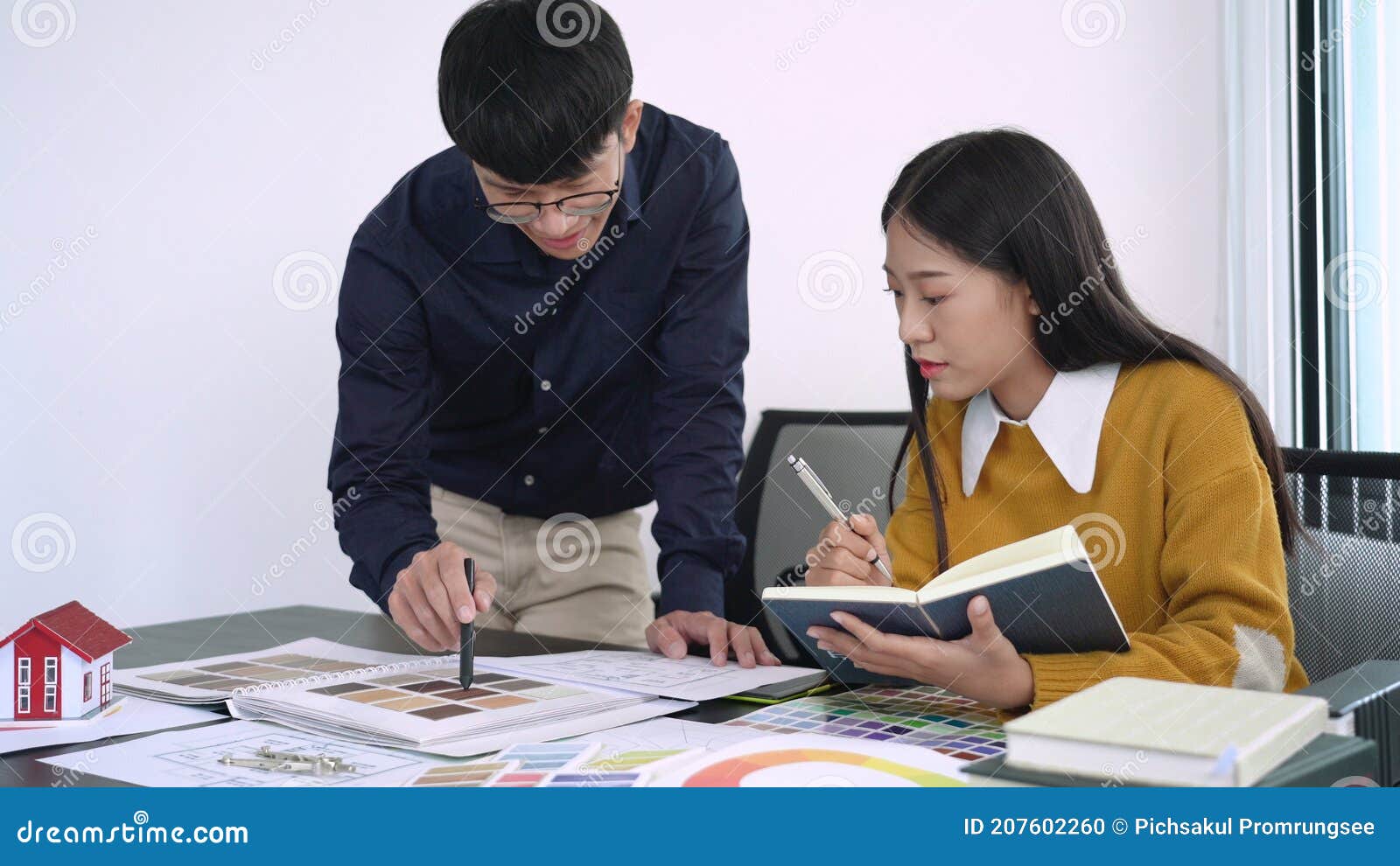 Team Designer Working Graphic with Color Chart on New Project with Work ...