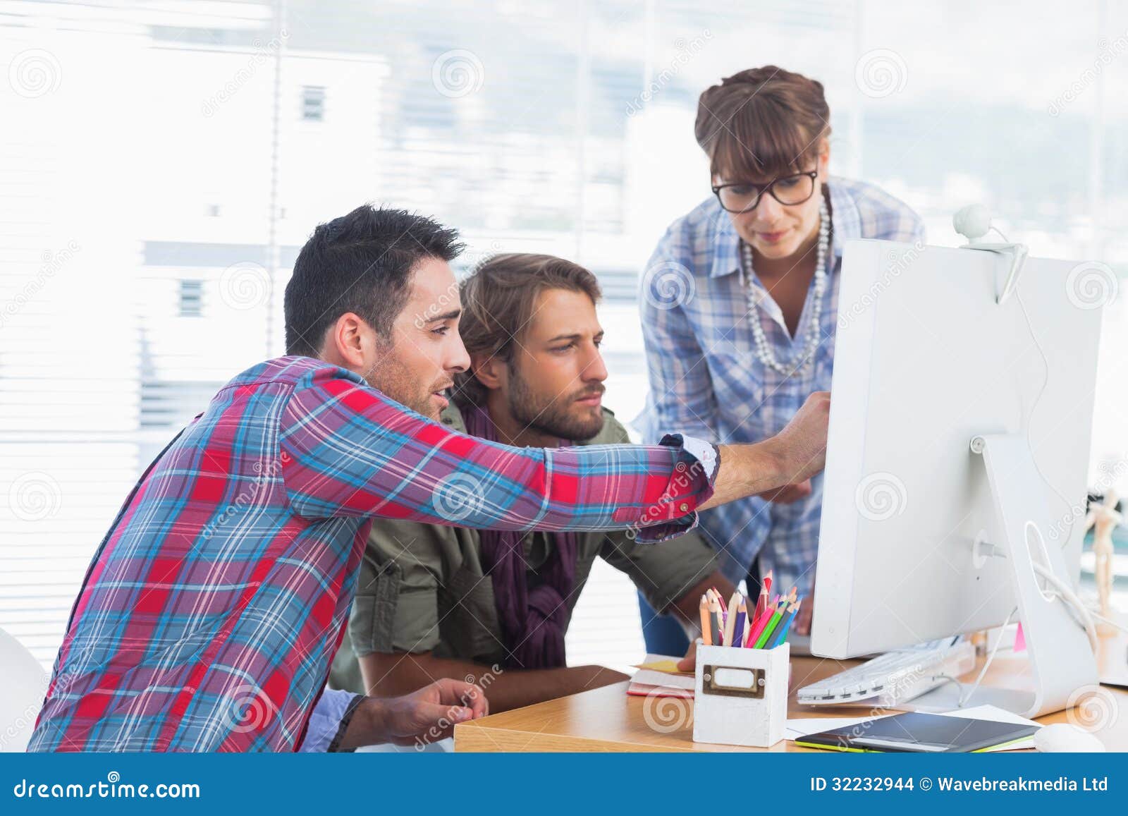 Team of Designers Working on a Computer Stock Photo - Image of desk ...