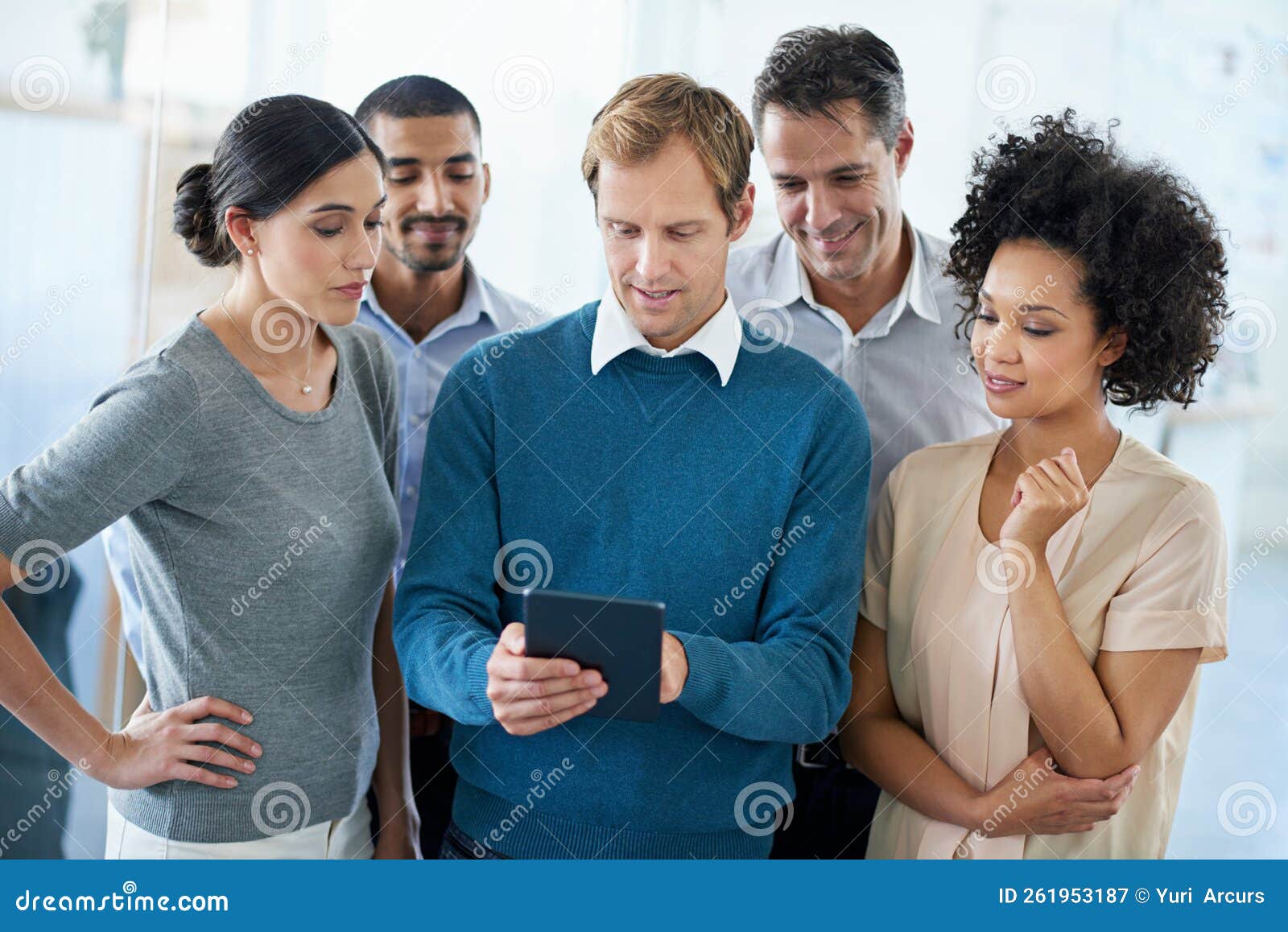 The Team that Designs Online. a Group of Diverse Colleagues Using a ...