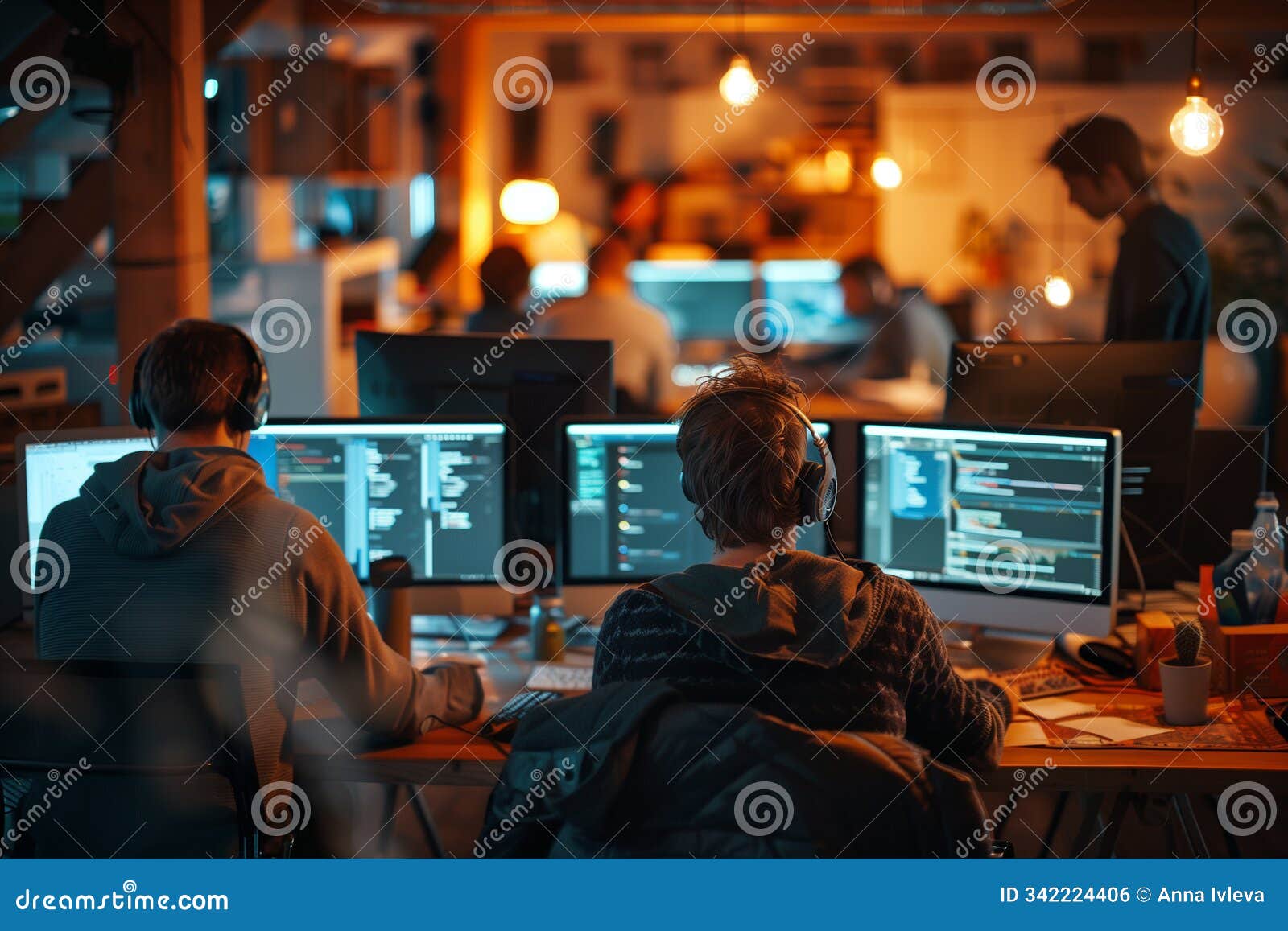 A Team of Developers Collaborating on a Project Using Version Control Software. Crowd at Desks ...