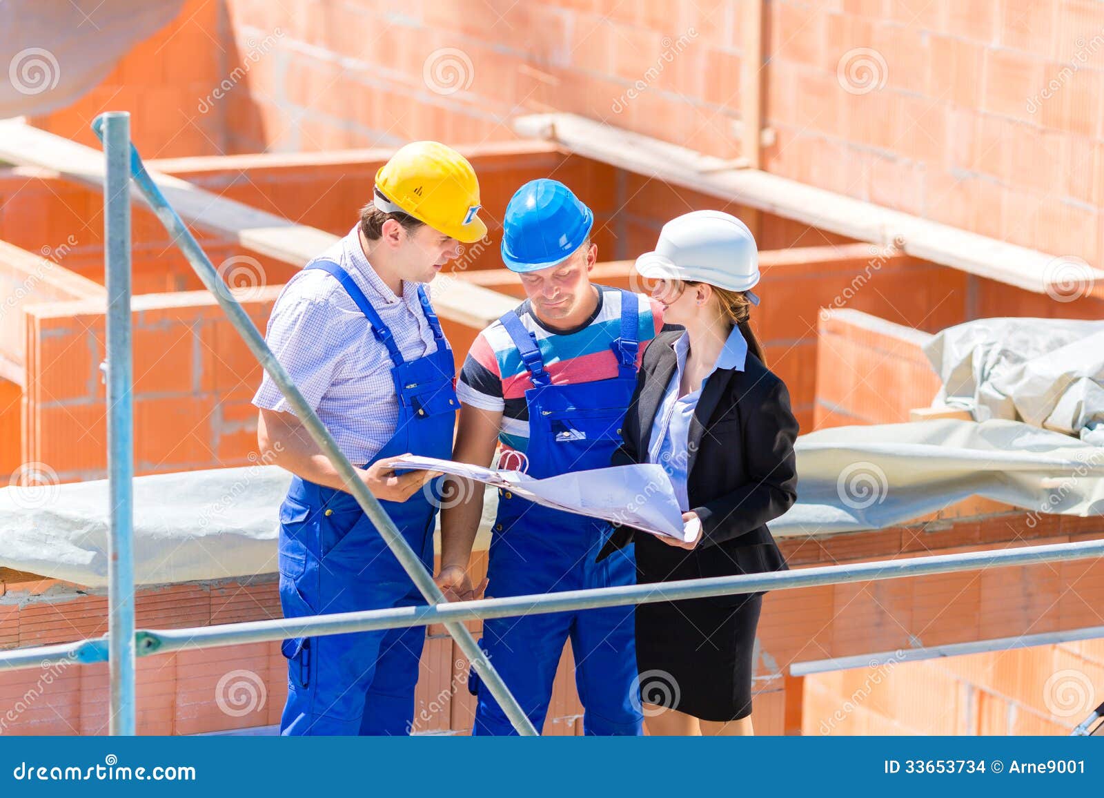 Team Discussing Construction or Building Site Plans Stock Photo - Image ...