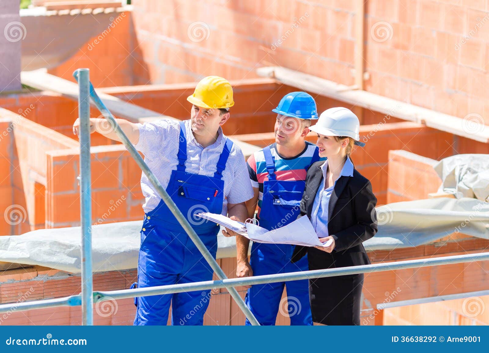 Team Discussing Construction or Building Site Plans Stock Photo - Image ...