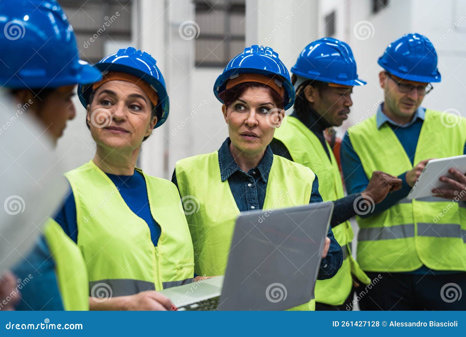 Team of Diverse Engineers Working in Robotic Factory Stock Photo ...
