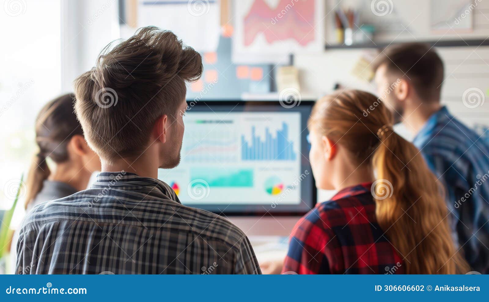 Team of Diverse Young People Around the Computer Screen Showing Graphs ...