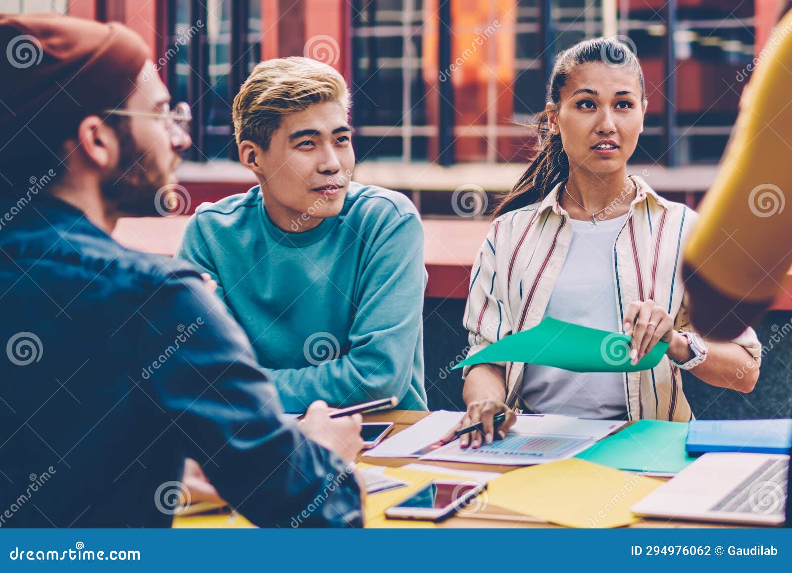 Team of Diverse Young People Collaborating with Each Other during ...