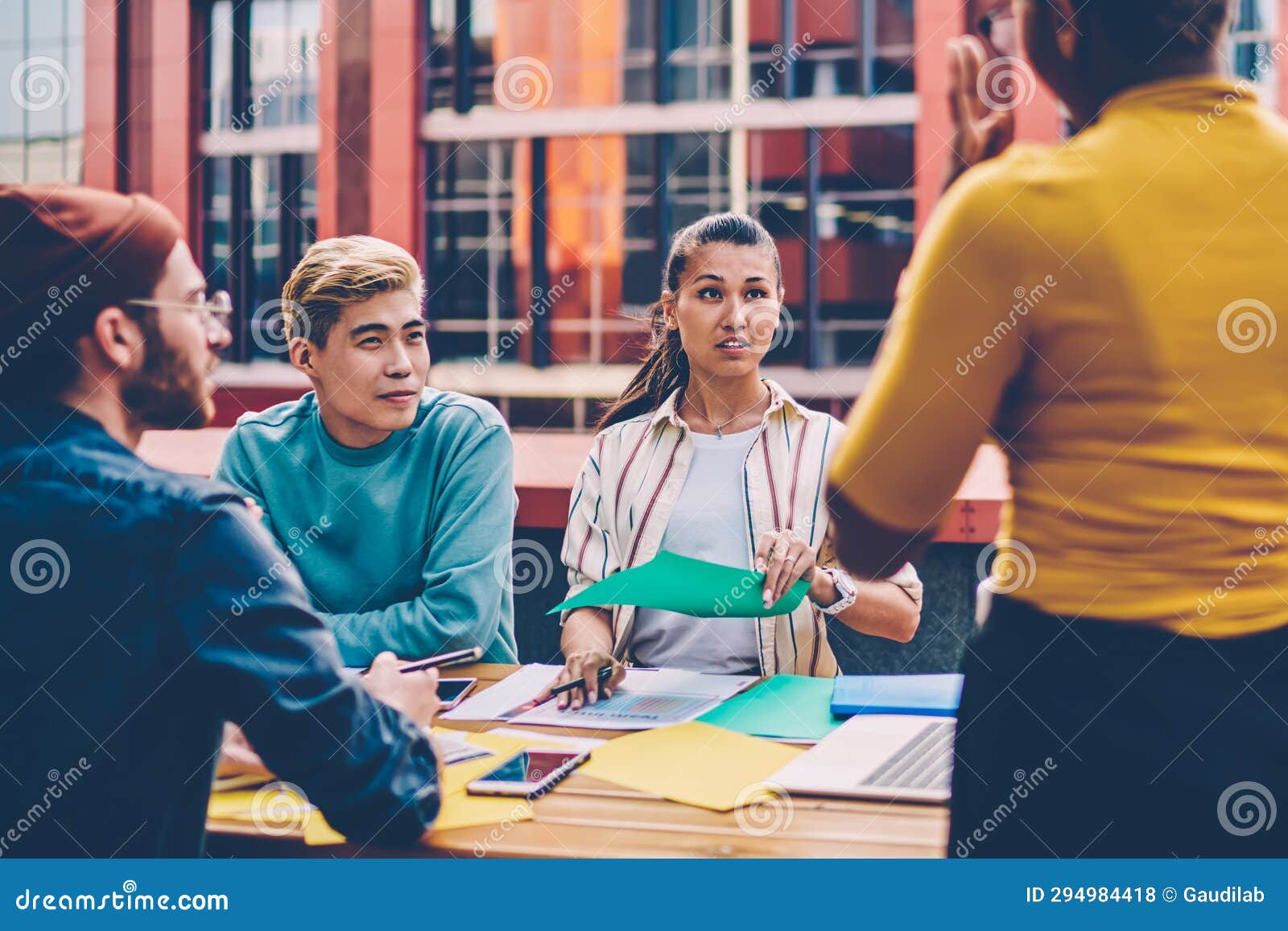 Team of Diverse Young People Collaborating with Each Other during ...
