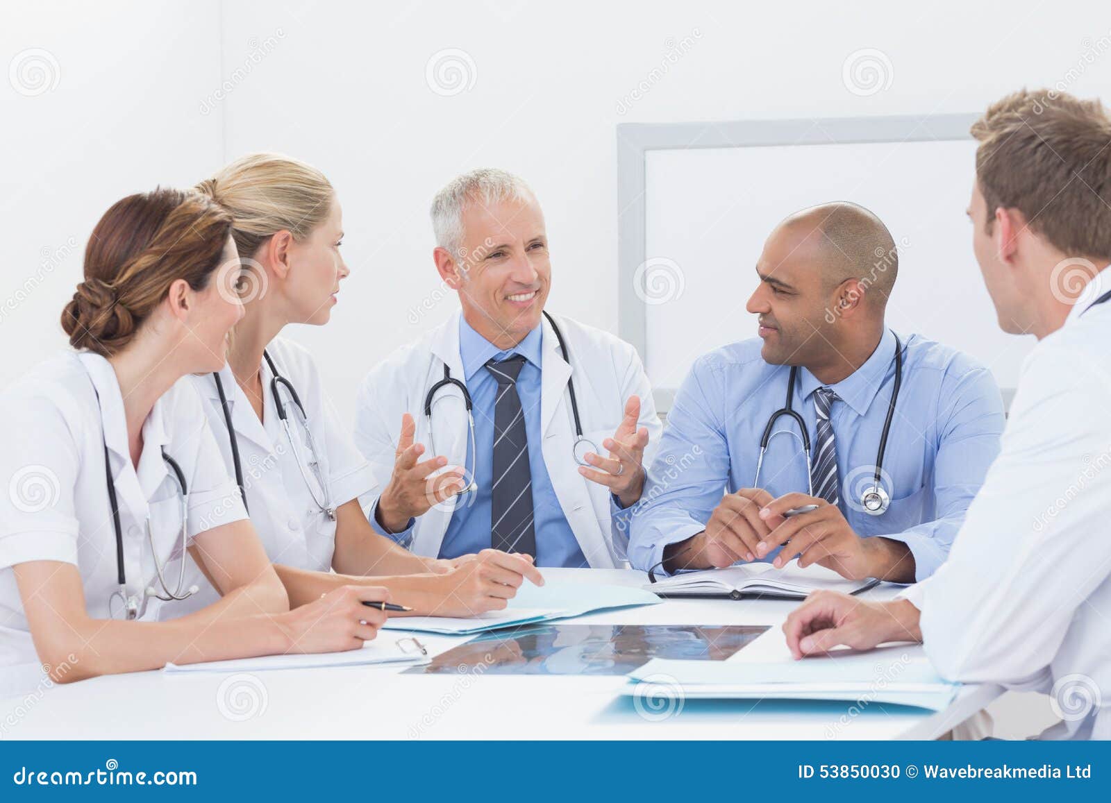 Team of Doctors Having a Meeting Stock Photo - Image of cheerful ...